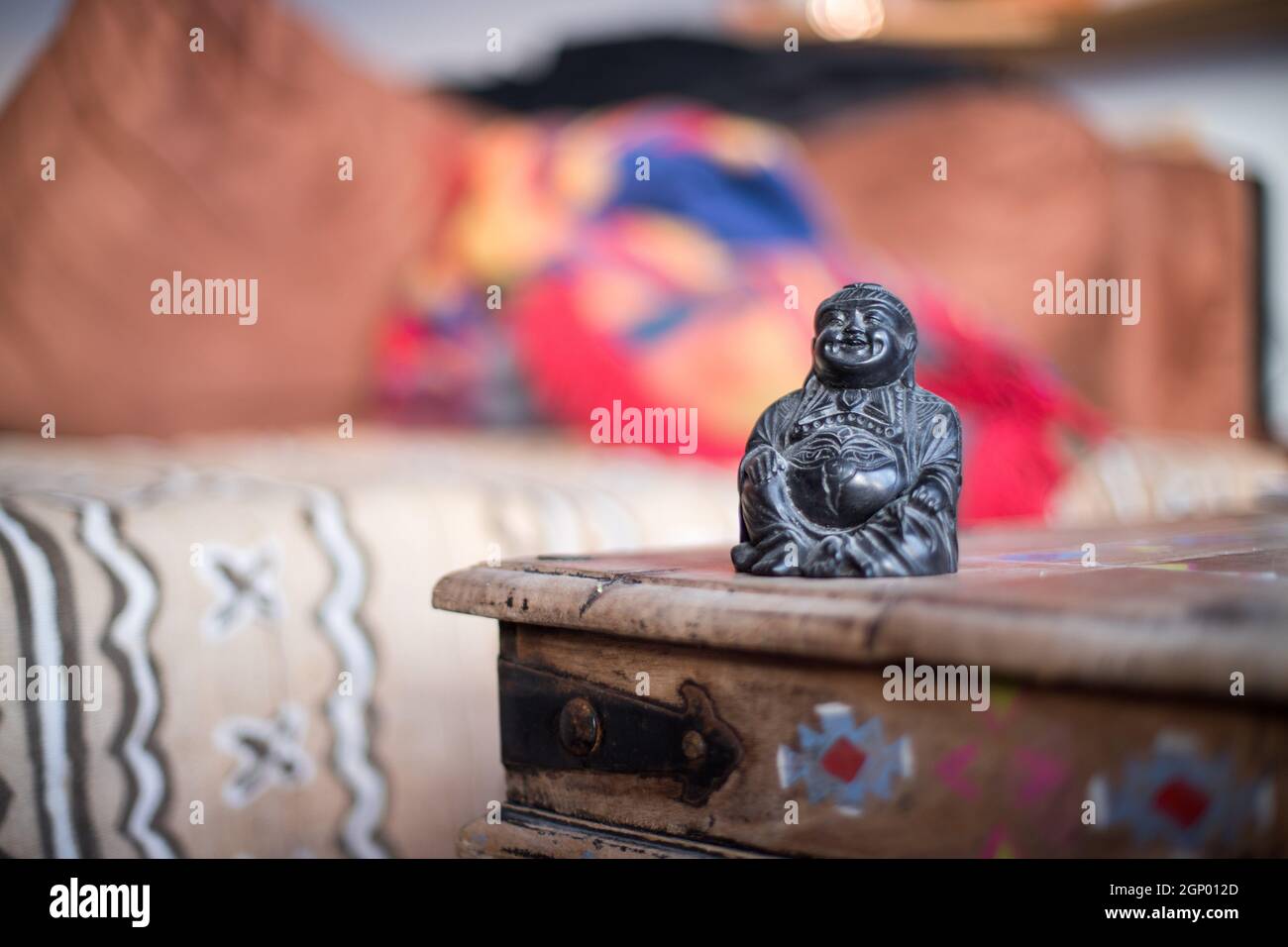 Feng shui: Buddha statue at on a table in the own living room Stock ...