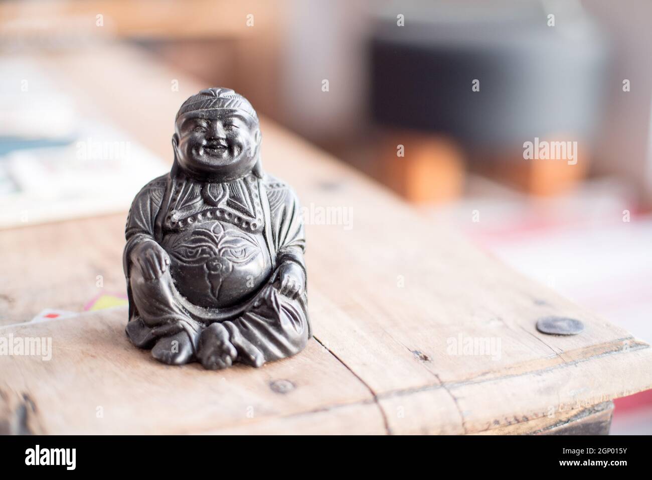 Feng shui: Buddha statue at on a table in the own living room Stock ...