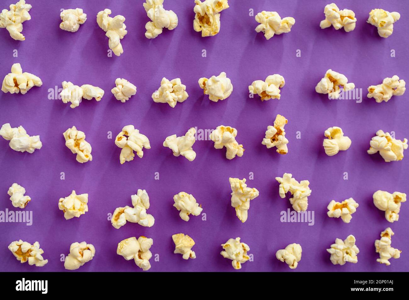 Popcorn pattern isolated on purple background, top view. Pop corn ...