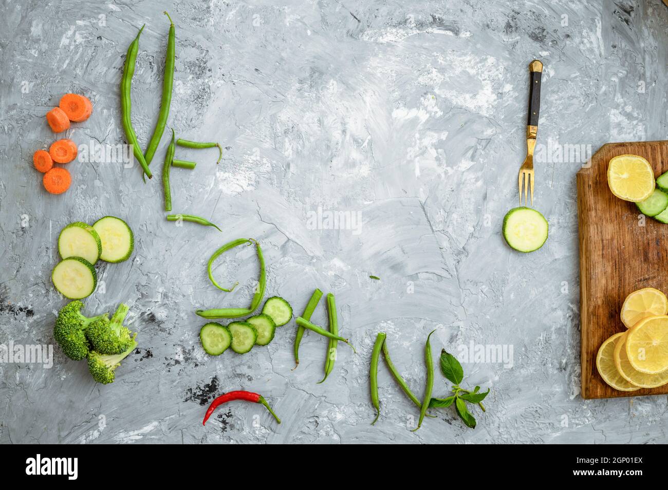 Vegetable Vegan word isolated on grunge abstract background, top view ...
