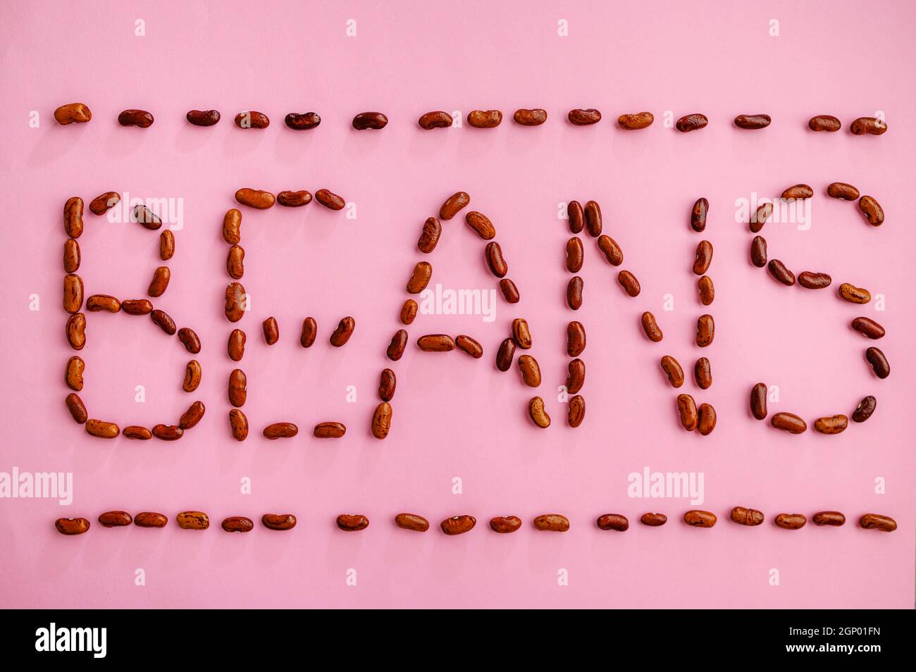 Beans word isolated on pink background, top view. Organic vegetarian ...
