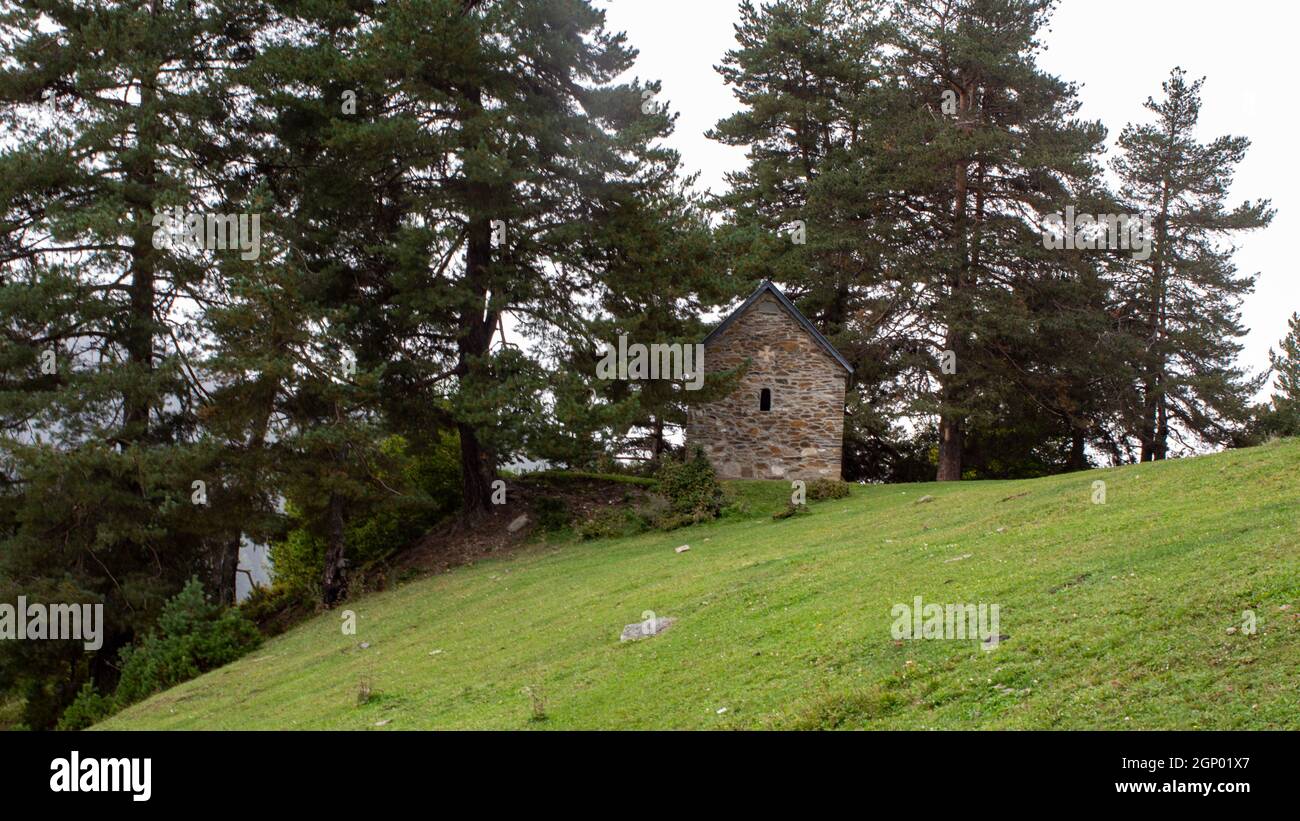 Small stone Orthodox Christian church in the mountains on a summer day ...