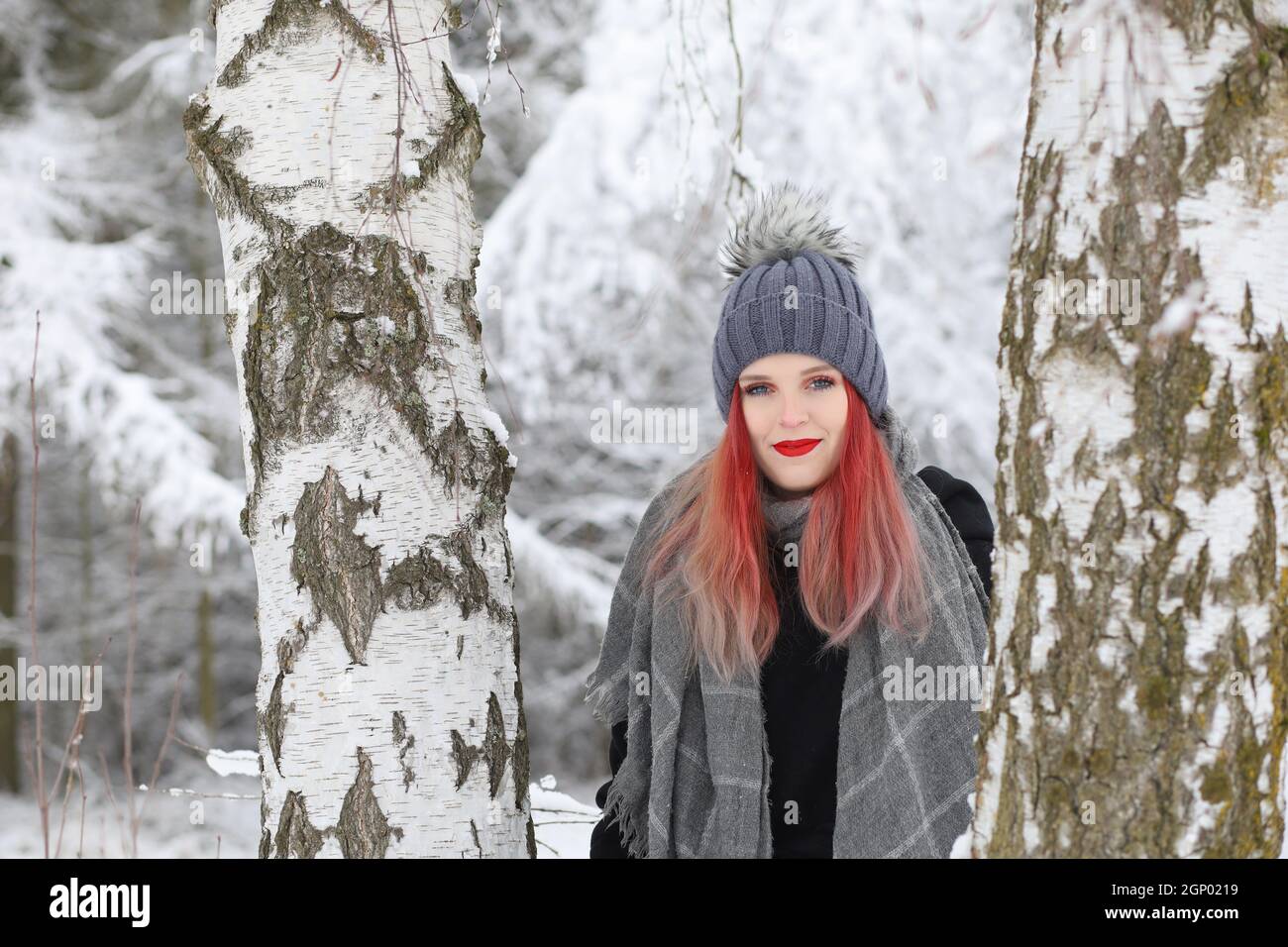 Front view portrait of attractive red hair girl posing between two ...