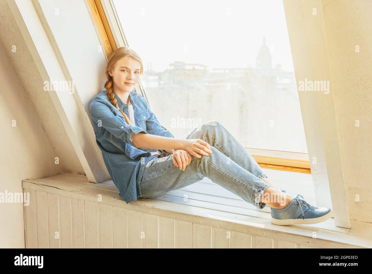 Young cute teenage girl in jeans, denim jacket and white T-shirt ...