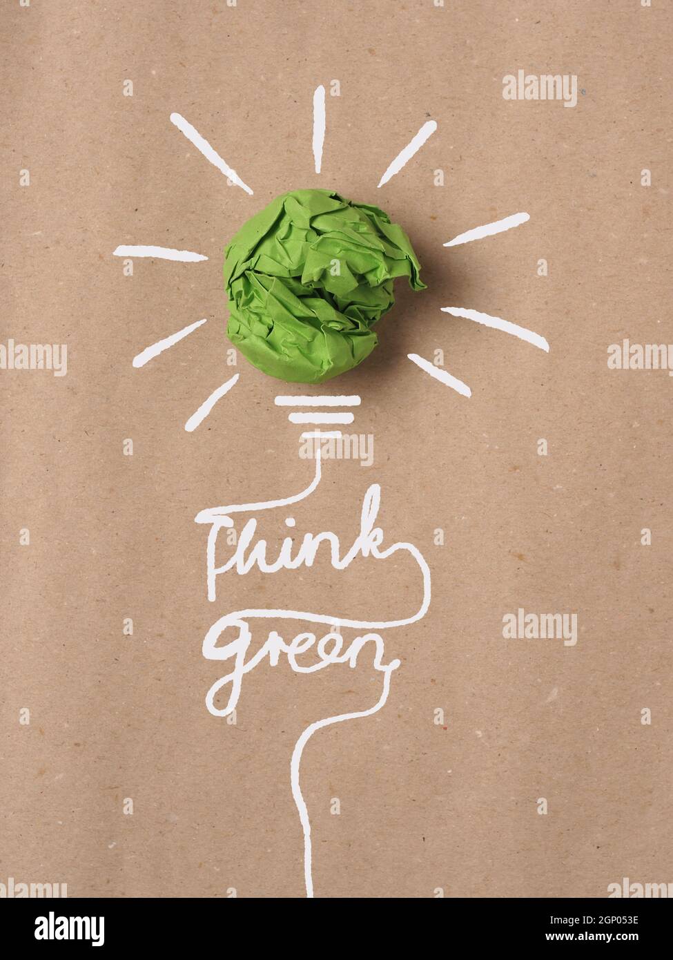 Recycled paper background with green crumpled paper ball as light bulb ...
