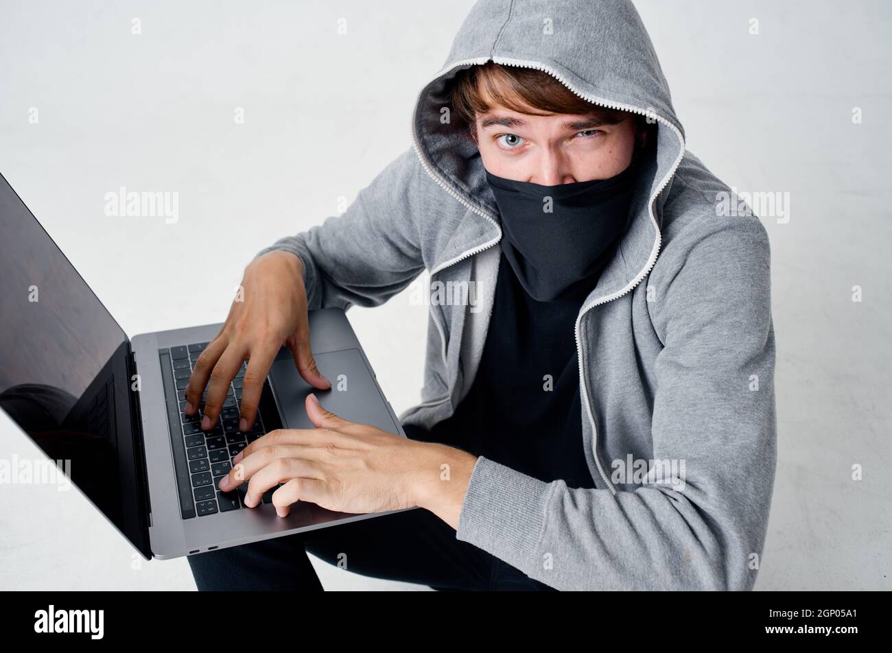 hacker stealth technique robbery safety hooligan light background Stock ...