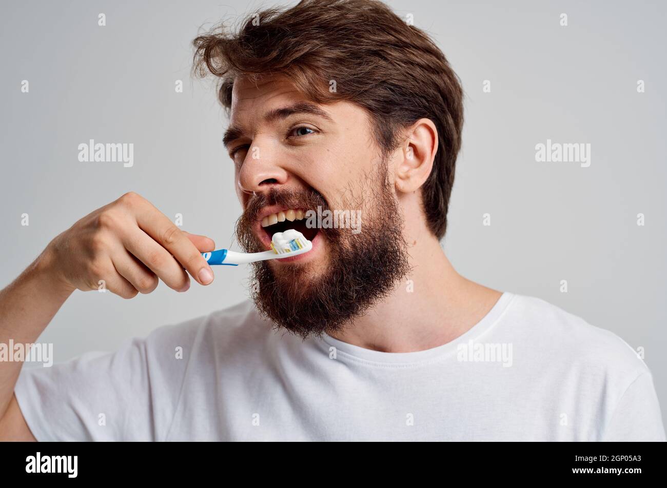 emotional man toothbrush in hand hygiene clean teeth isolated ...