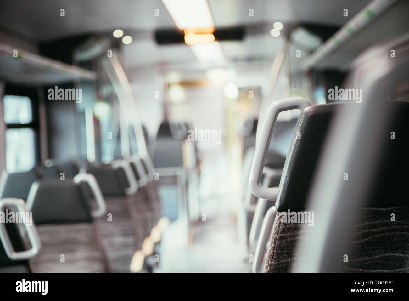 Interior of a public transport train, blurry background Stock Photo - Alamy