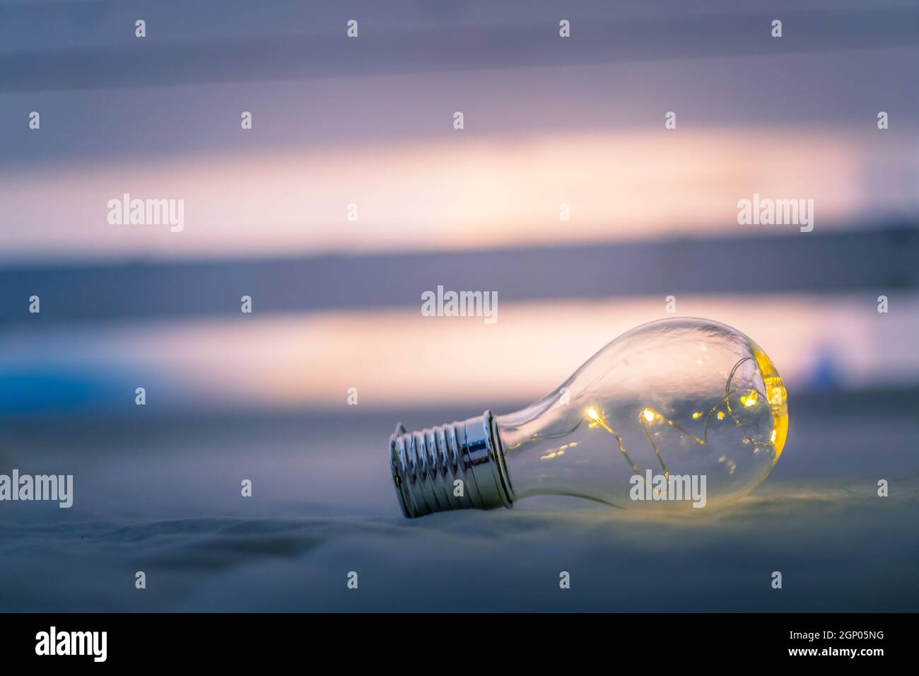 LED light bulb is lying in the bed. Symbol for ideas and innovation ...