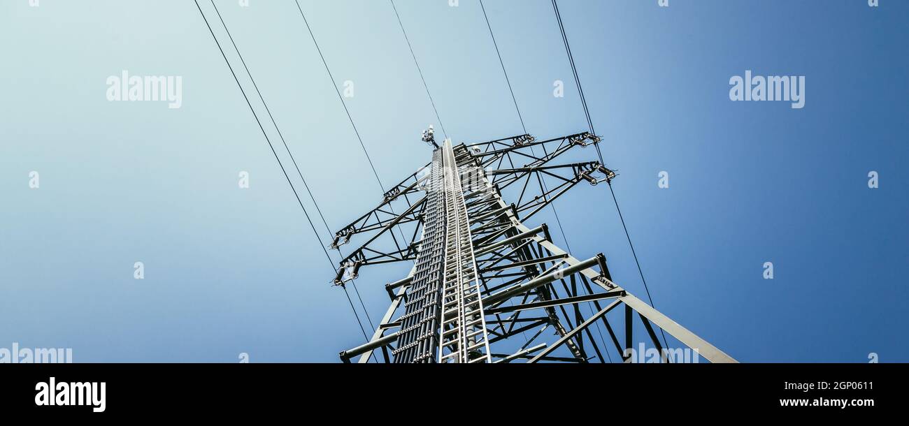 Picture of an electrical tower or pylon, blue sky in the background ...