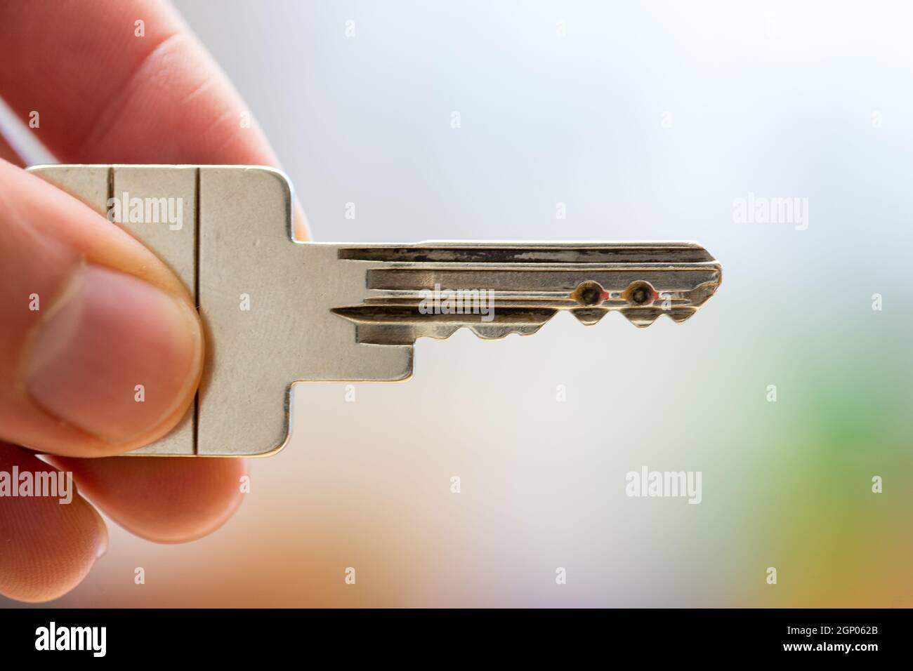 Holding a house key in the hand: New home and property Stock Photo - Alamy