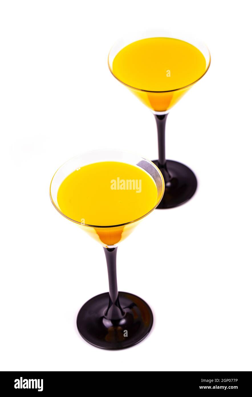The Yellow Two Cocktail glasses in white background Stock Photo - Alamy