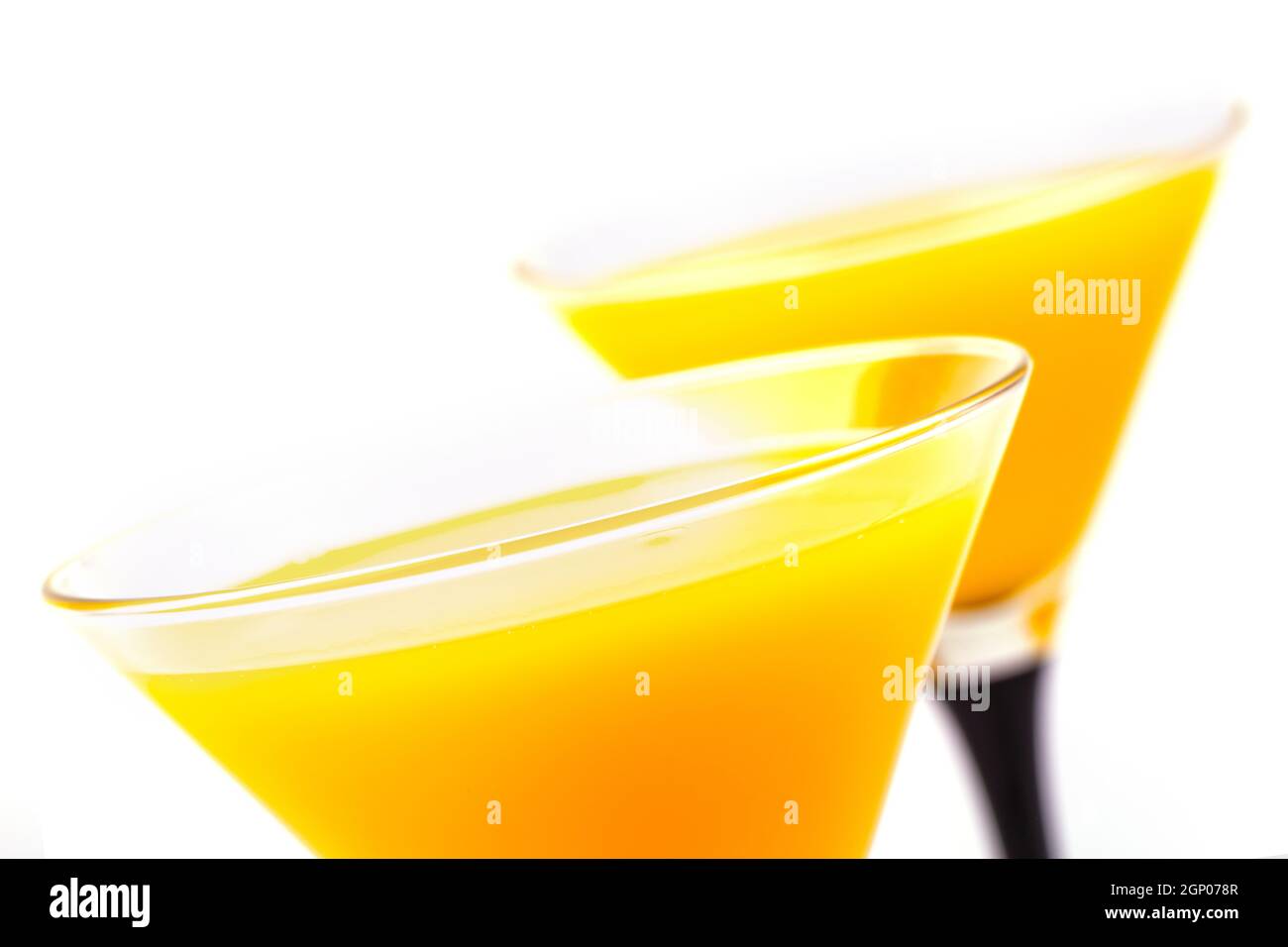 The Yellow Two Cocktail glasses in white background Stock Photo - Alamy