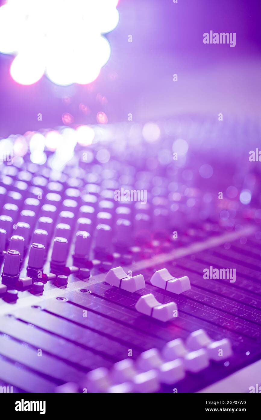 Professional music production in a sound recording studio, mixer desk ...