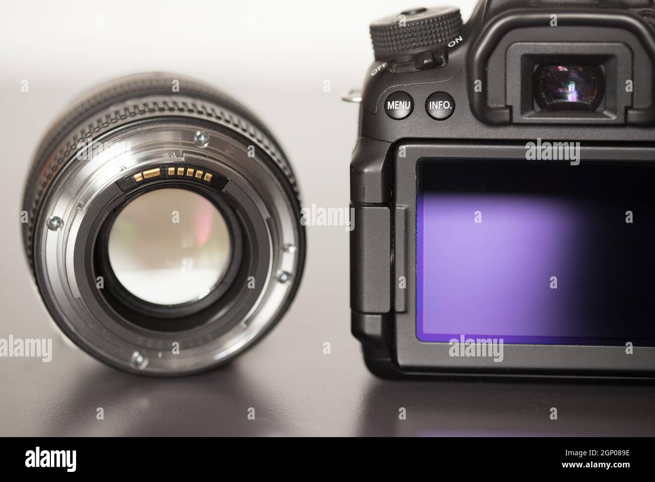 Back view of a professional reflex camera with flip lsd screen and a ...