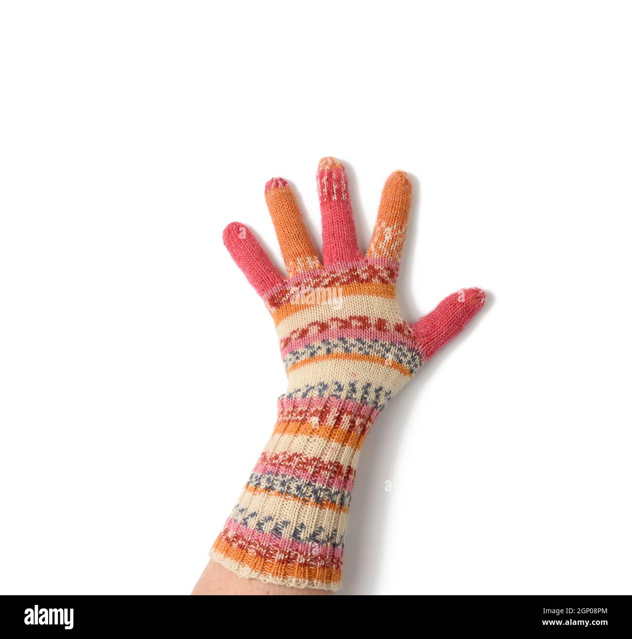 female palm in knitted multi-colored mittens on a white background ...