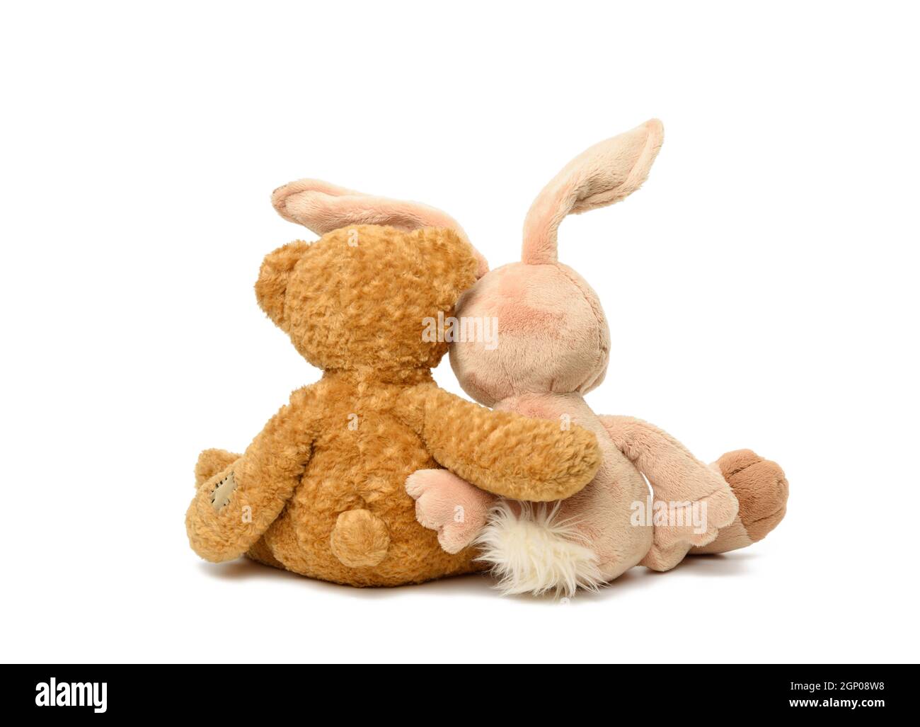 brown teddy bear and cute rabbit sit on white isolated background, toys ...