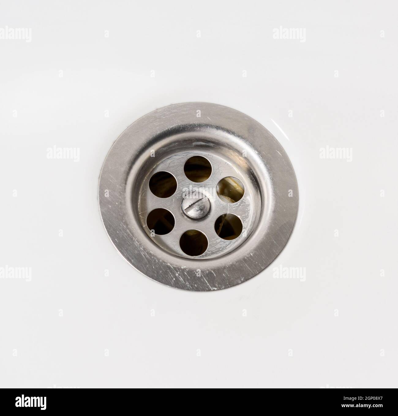 sink drain with metal filter, white faience, close up Stock Photo - Alamy