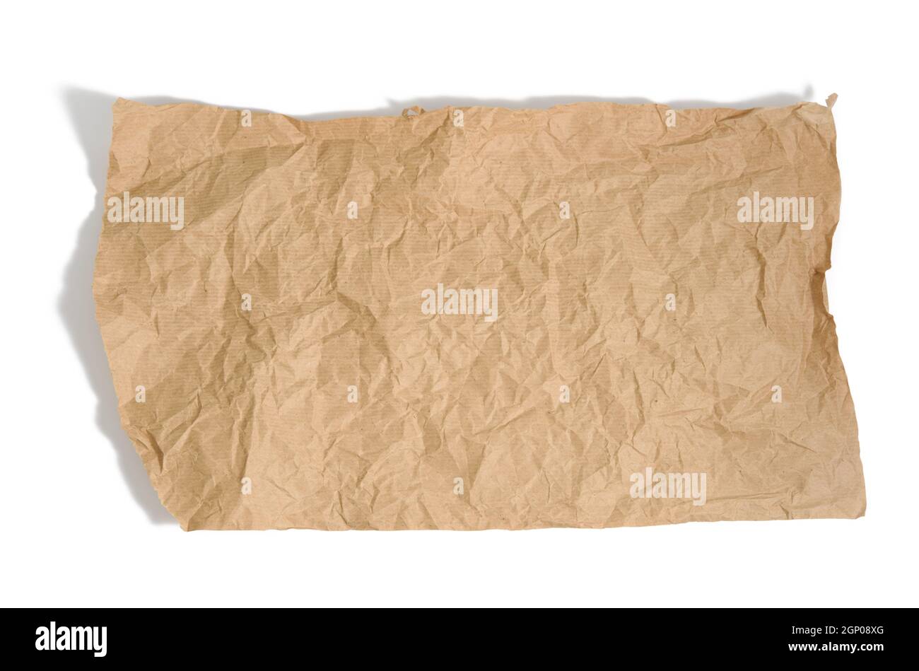 piece of brown parchment paper with torn edges isolated on white ...