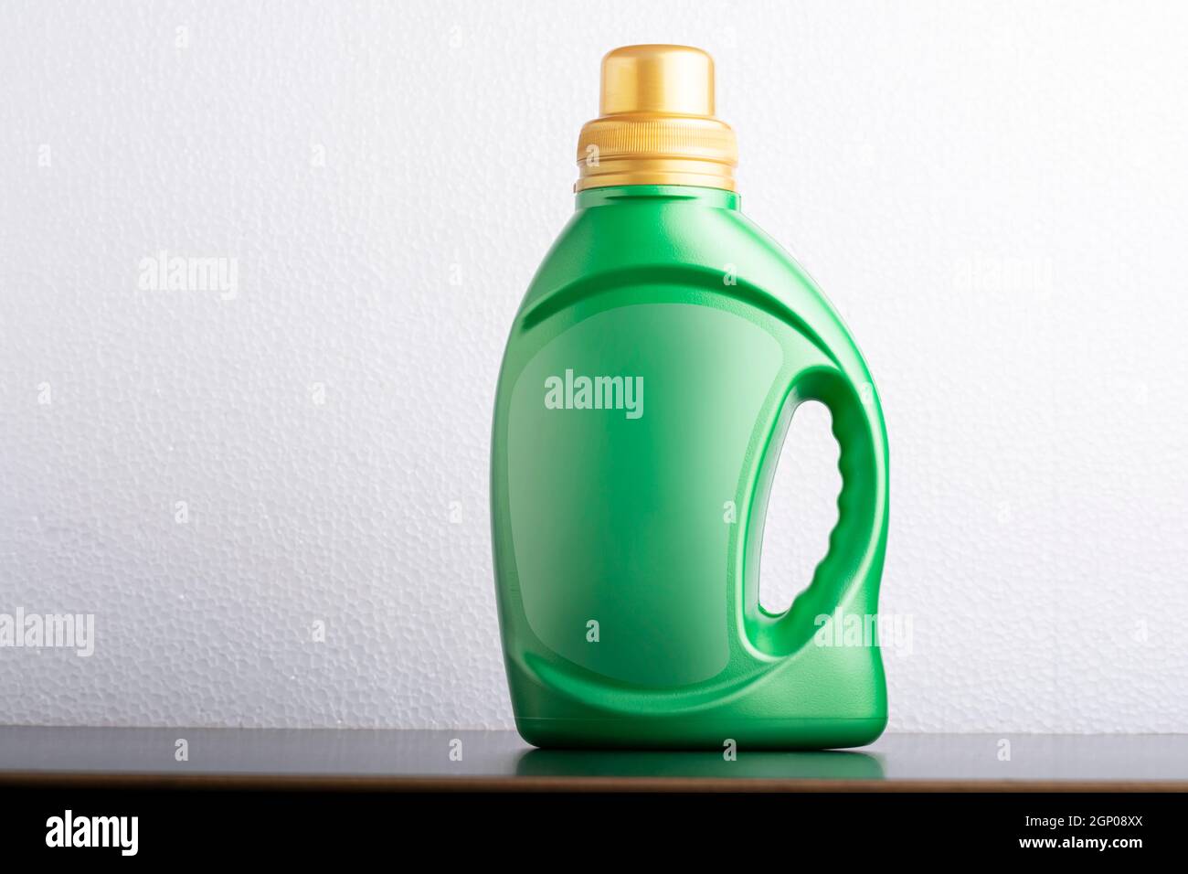 Cloth detergent liquid bottle in front of light gray background ...