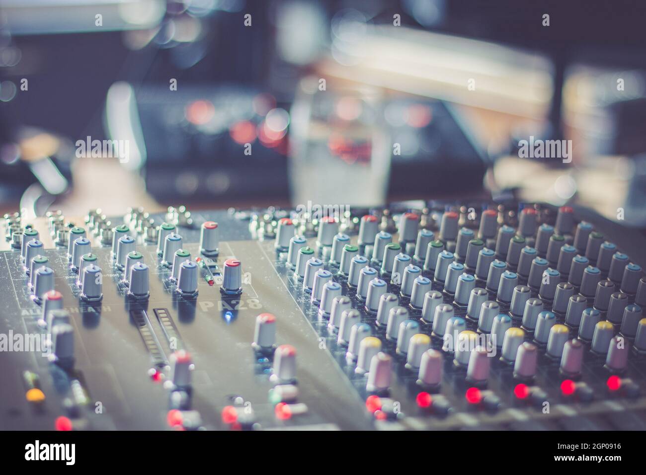 Professional music production in a sound recording studio, mixer desk ...