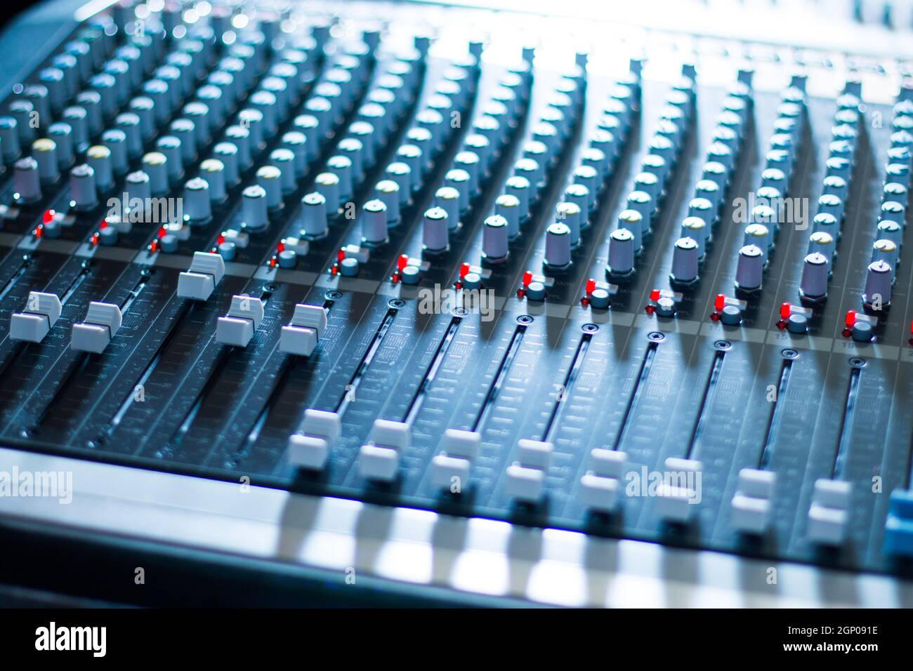 Professional music production in a sound recording studio, mixer desk ...