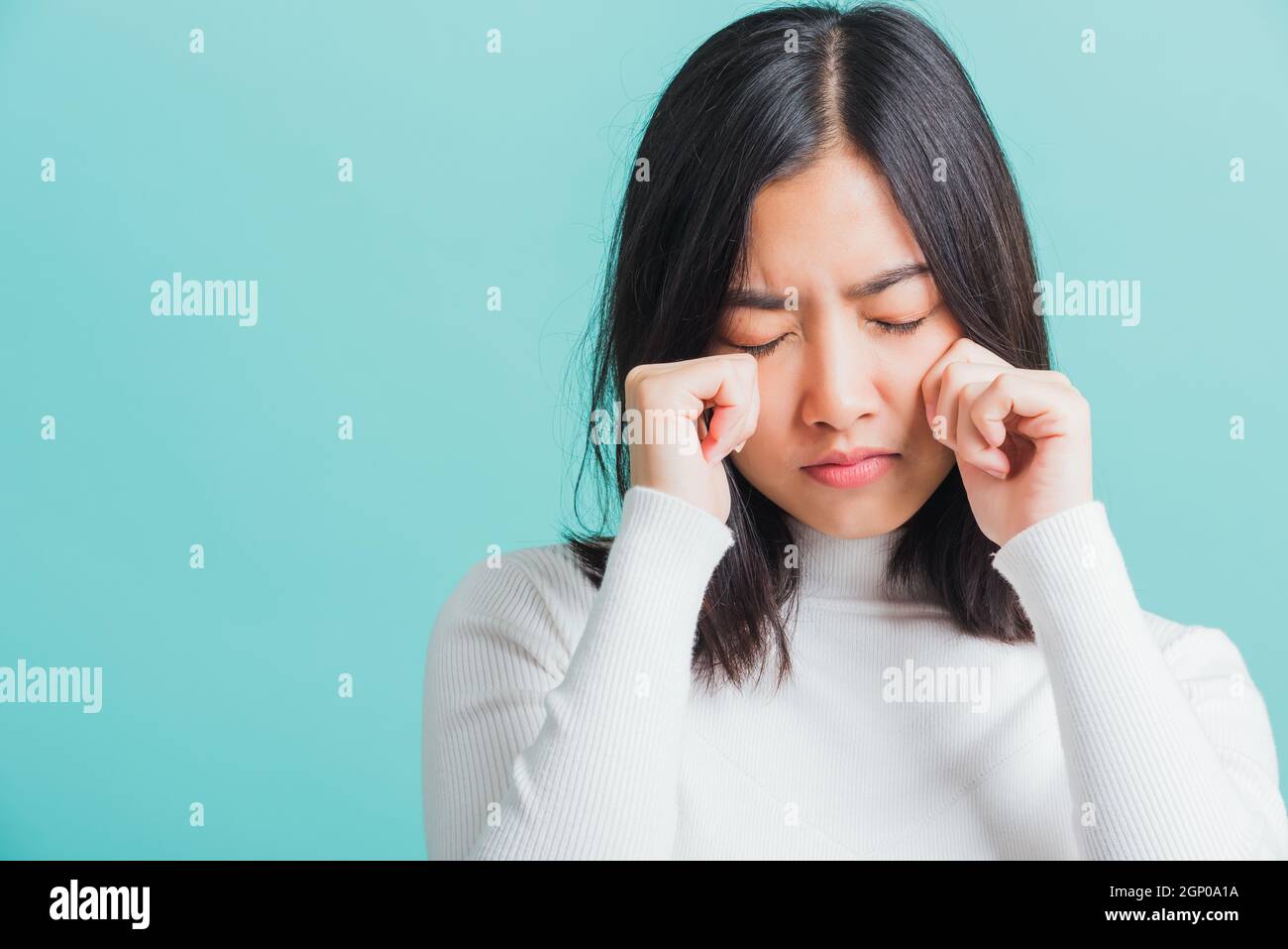 Young asian woman crying while wiping tears hi-res stock photography ...