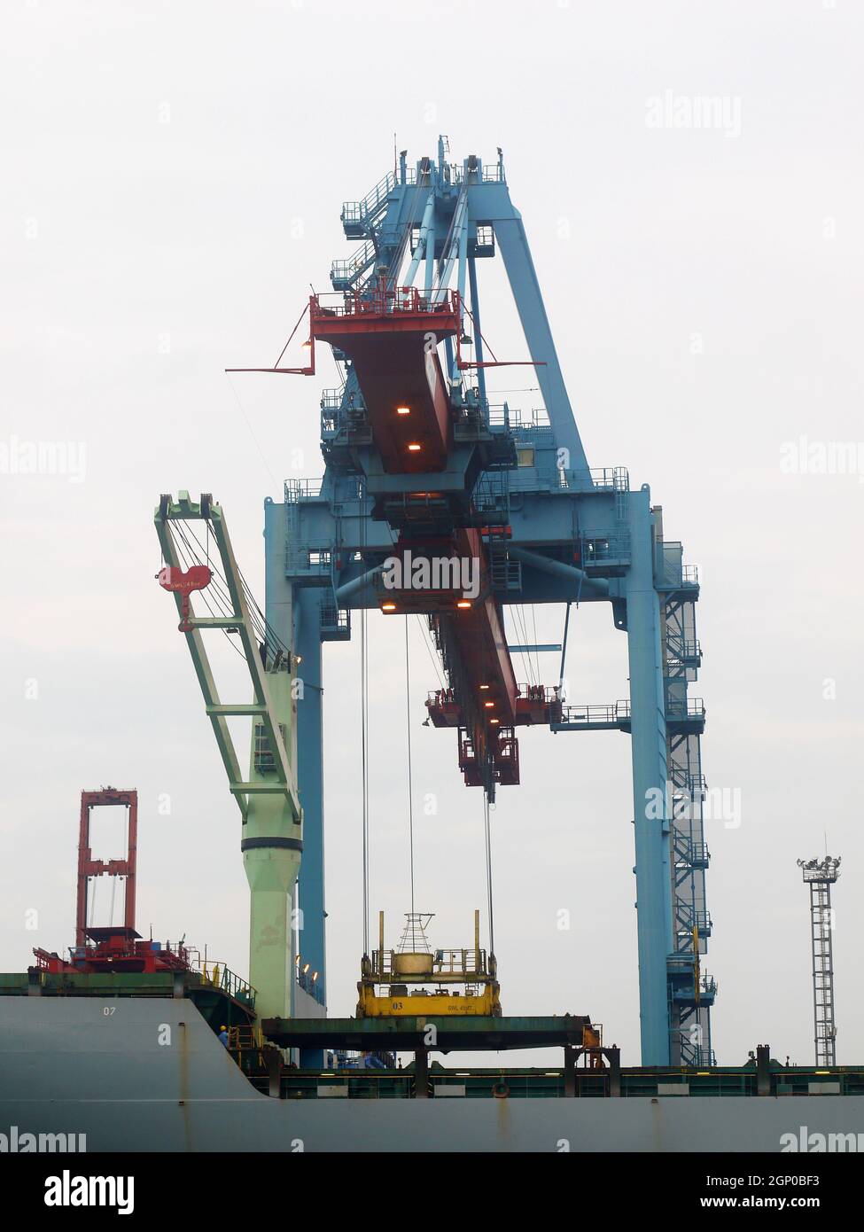 a construction crane used for loading and unloading containers at the ...