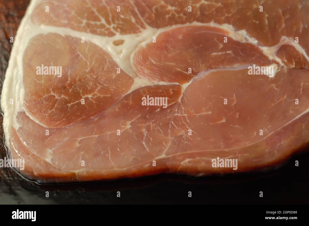 Smoked gammon steak formed from selected cuts of cured pork leg ...