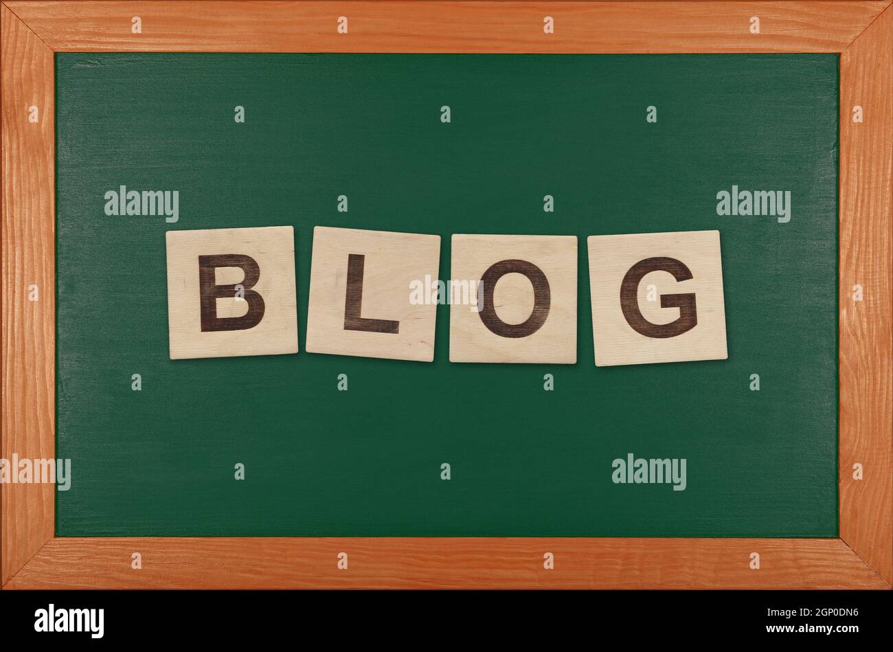 BLOG wooden letter sign on green chalkboard background Stock Photo - Alamy