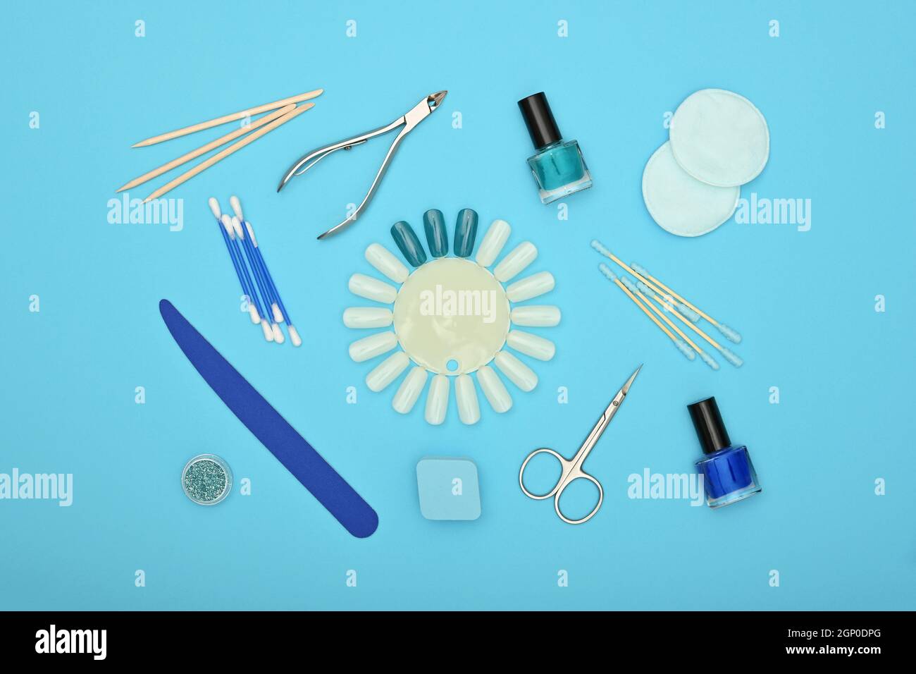 Close up feminine hygiene, beauty, nail care and manicure set on blue ...
