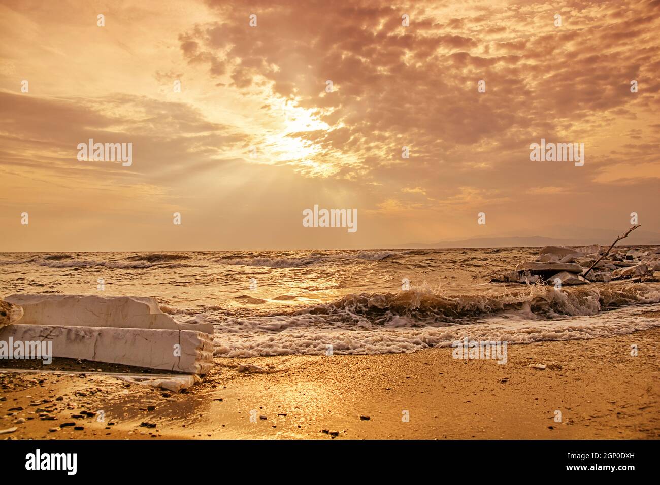 Sunset at sea with beach background at sundown Stock Photo - Alamy