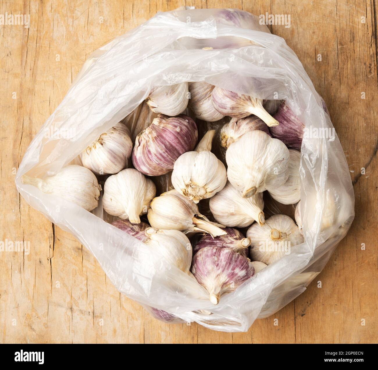 fresh garlic in a plastic bag, top view Stock Photo - Alamy