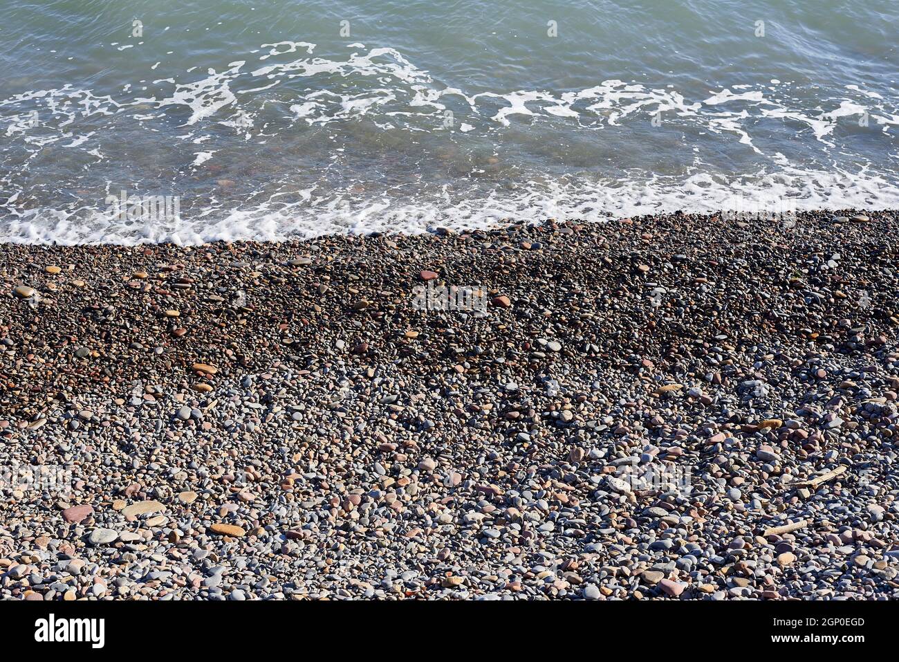 Small rocks beach shore, unfocused background, nobody, foreground ...