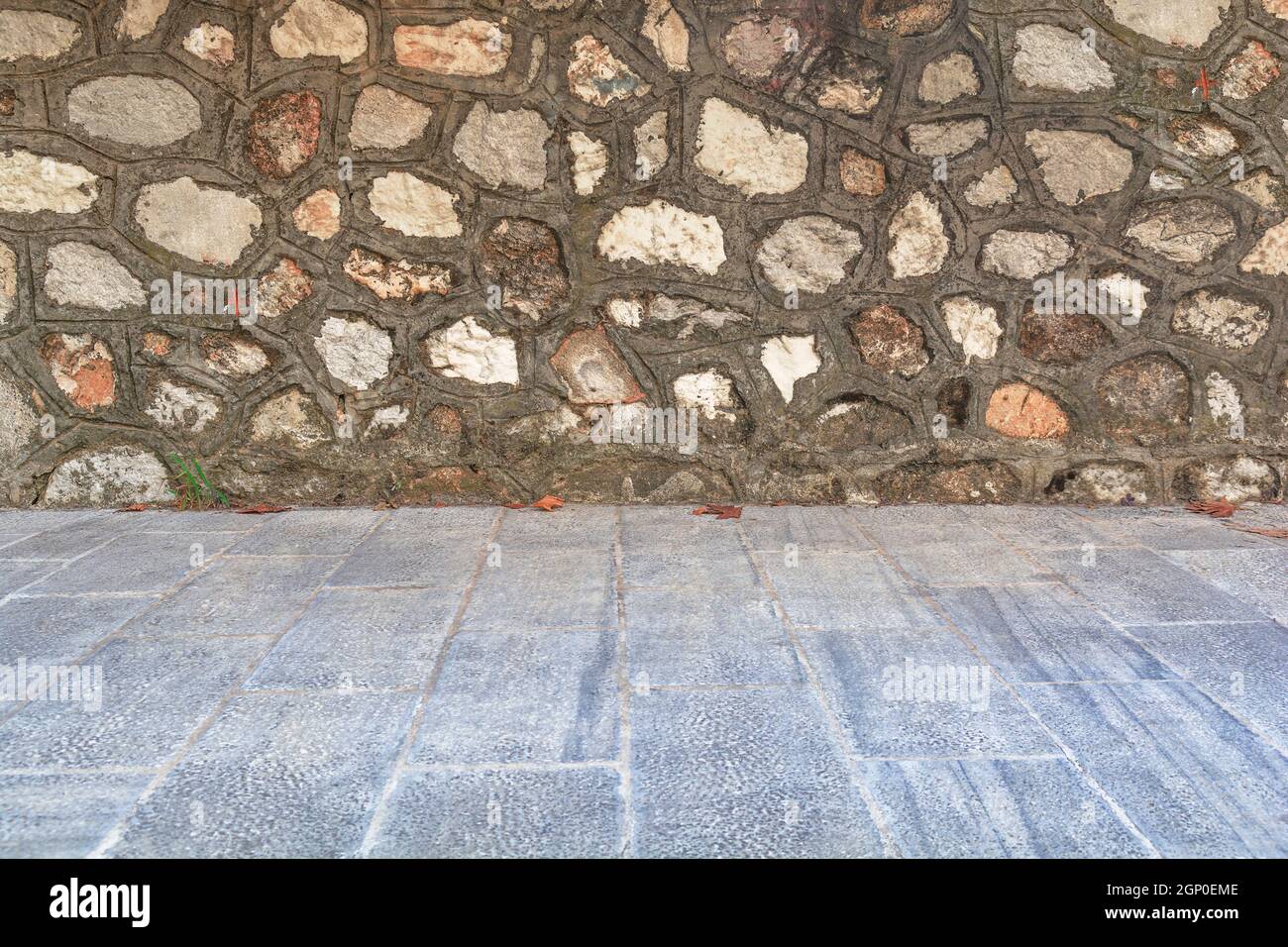 Tiled stone wall, background and texture with floor made of blue blocks ...