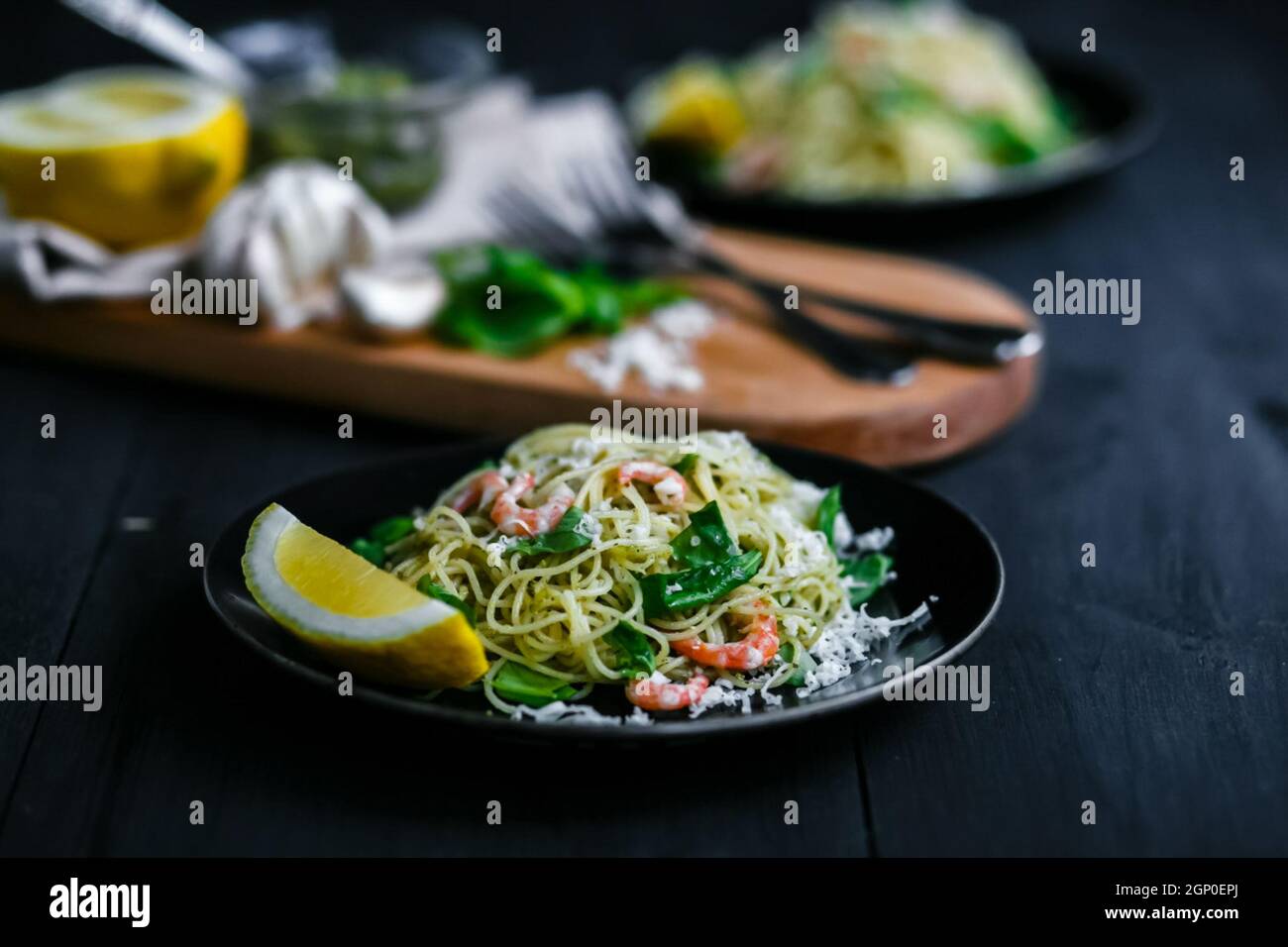 Noodles with seafood and lemon. A dish in a restaurant Stock Photo - Alamy