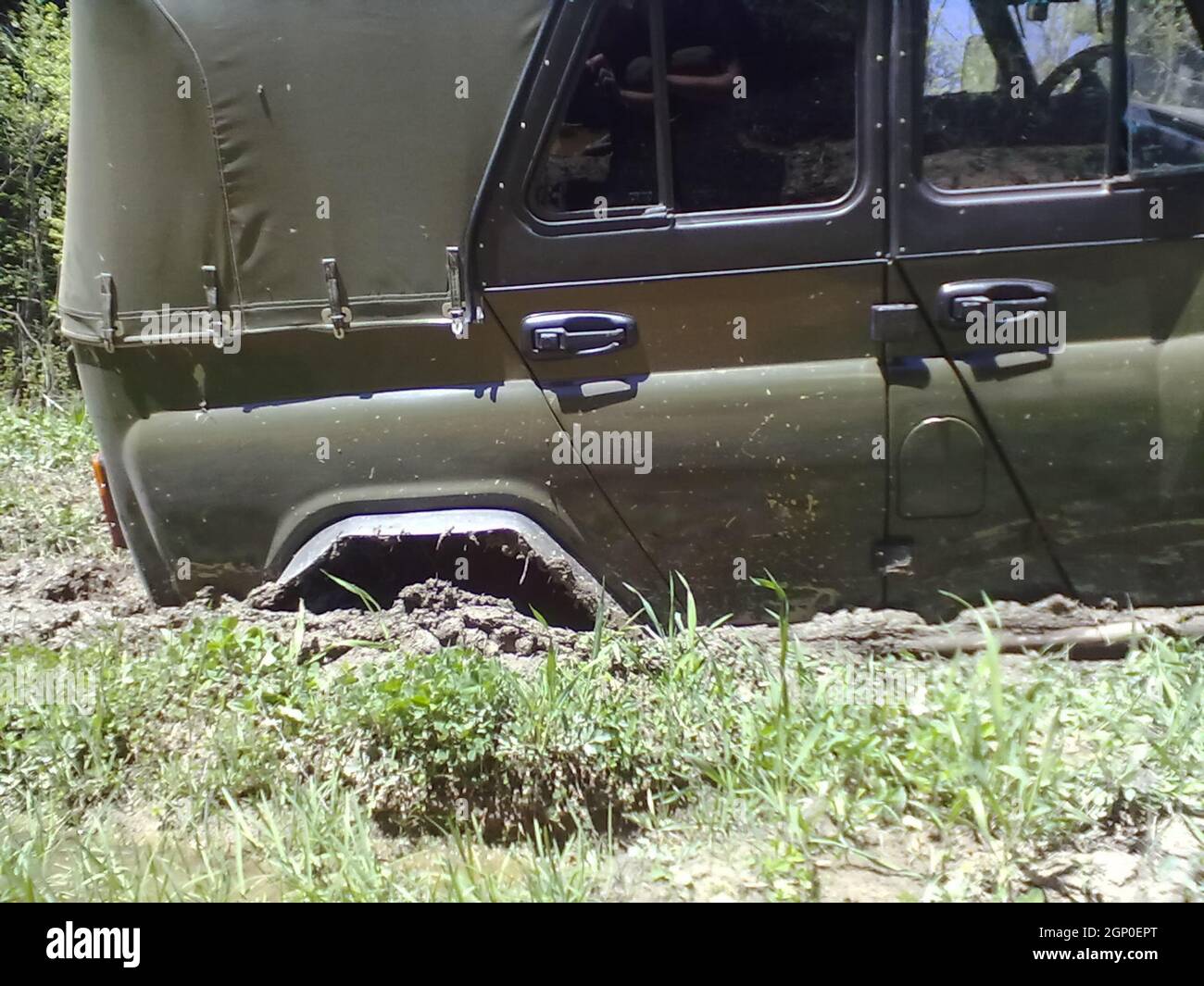 It's a very dirty car. The SUV is driving through the mud Stock Photo ...