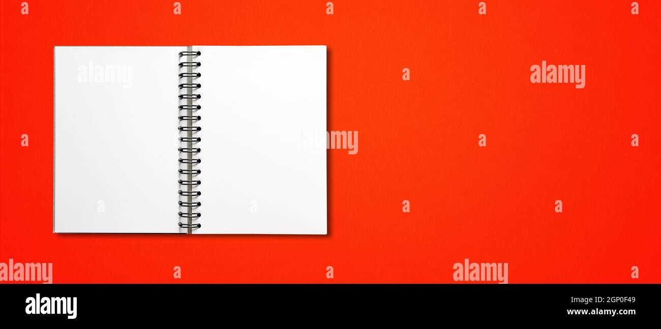 Blank open spiral notebook mockup isolated on red horizontal banner ...