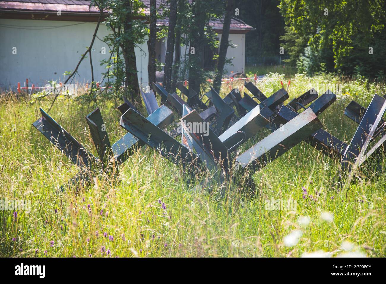 Abandoned iron anti tank barrier on a feral field Stock Photo - Alamy