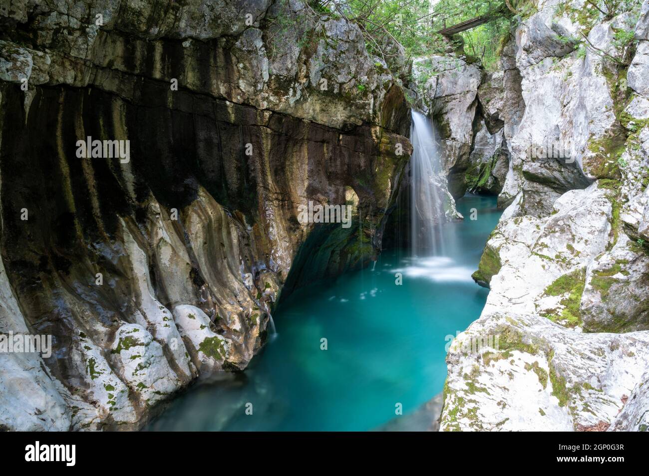 Waterfall in a beautiful majestic big gorge of turquoise soca river ...