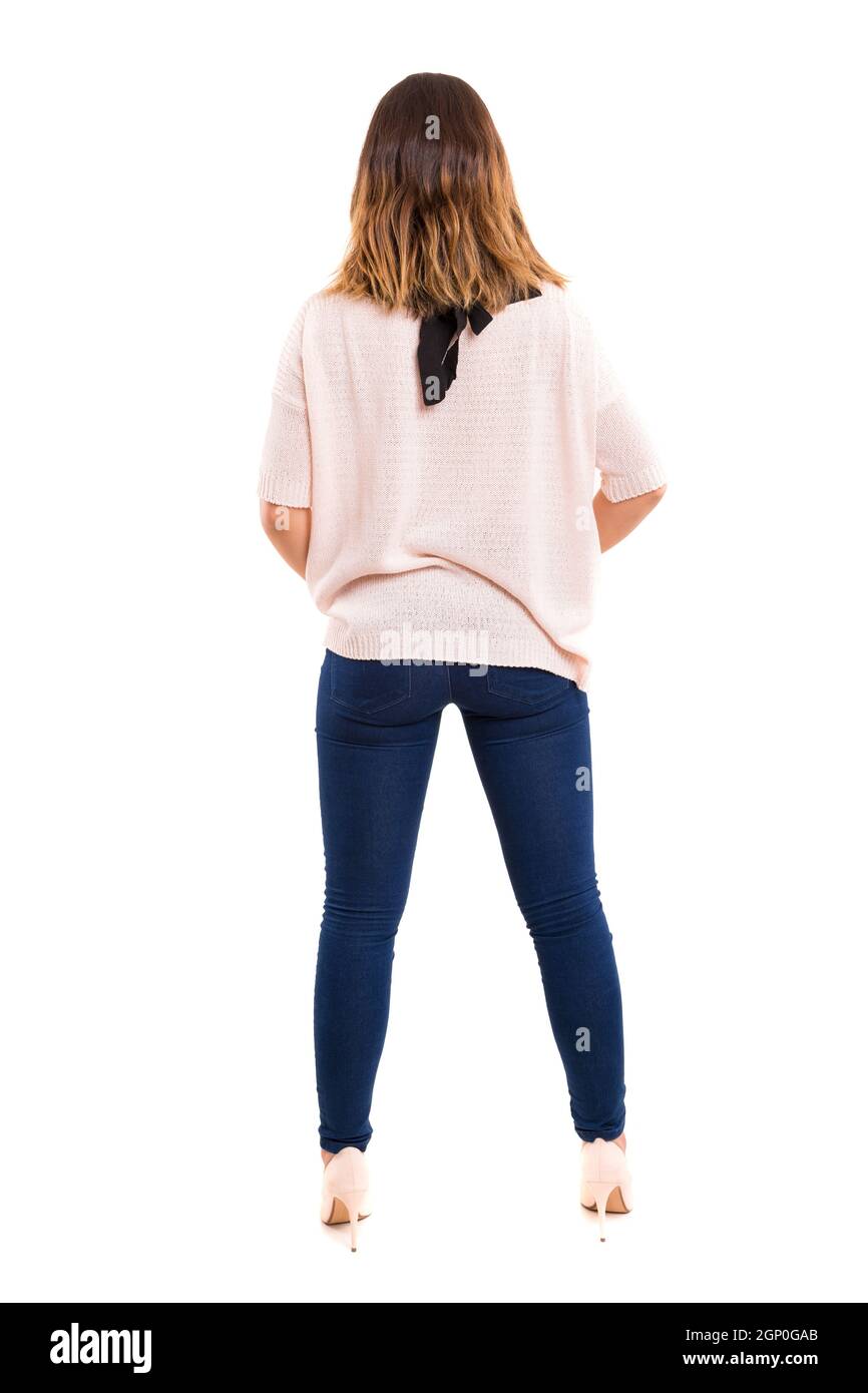 Woman posing with her back faced to camera, isolated over copy space ...