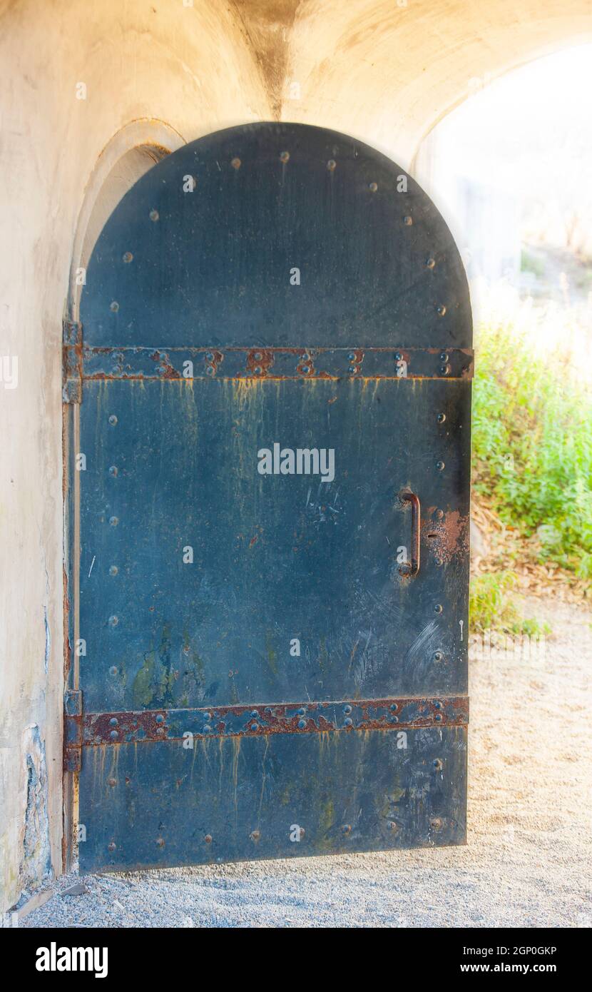 The old opened metal door in a medieval castle close up Stock Photo - Alamy