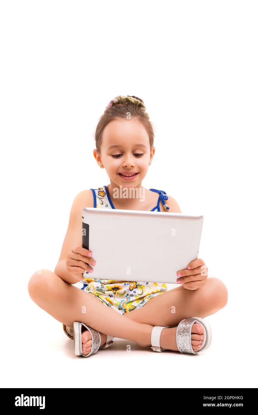 Small girl playing with her new tablet computer Stock Photo - Alamy