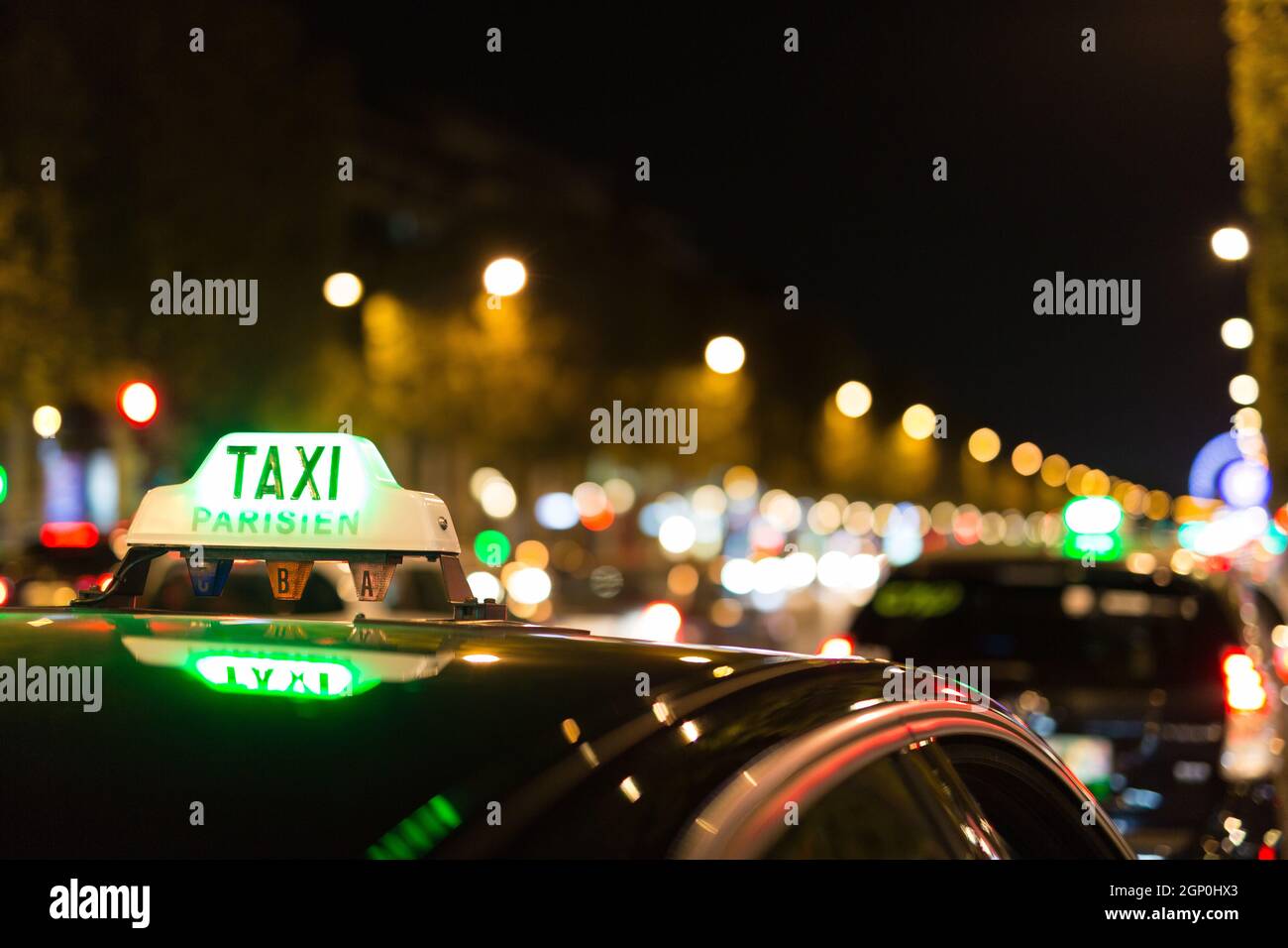 French taxi with the champs elysees avenue in background Stock Photo ...