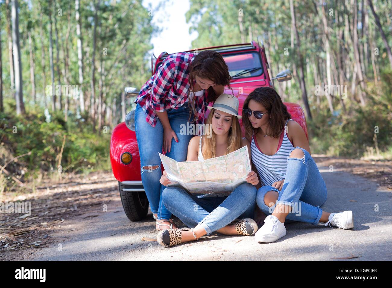 Group of friends on a roadtrip through countryside Stock Photo - Alamy