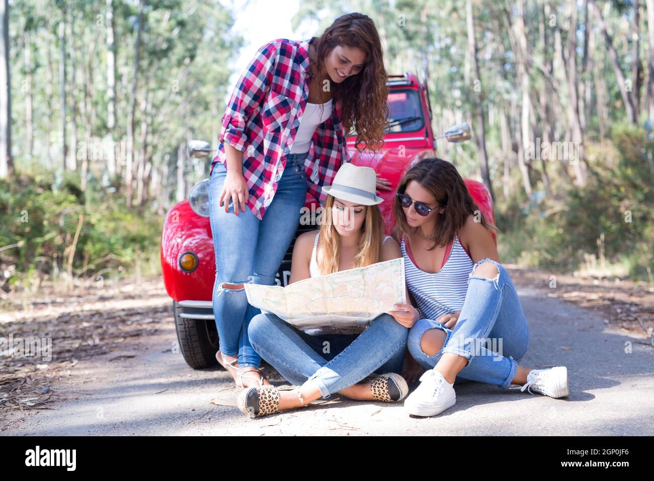 Group of friends on a roadtrip through countryside Stock Photo - Alamy