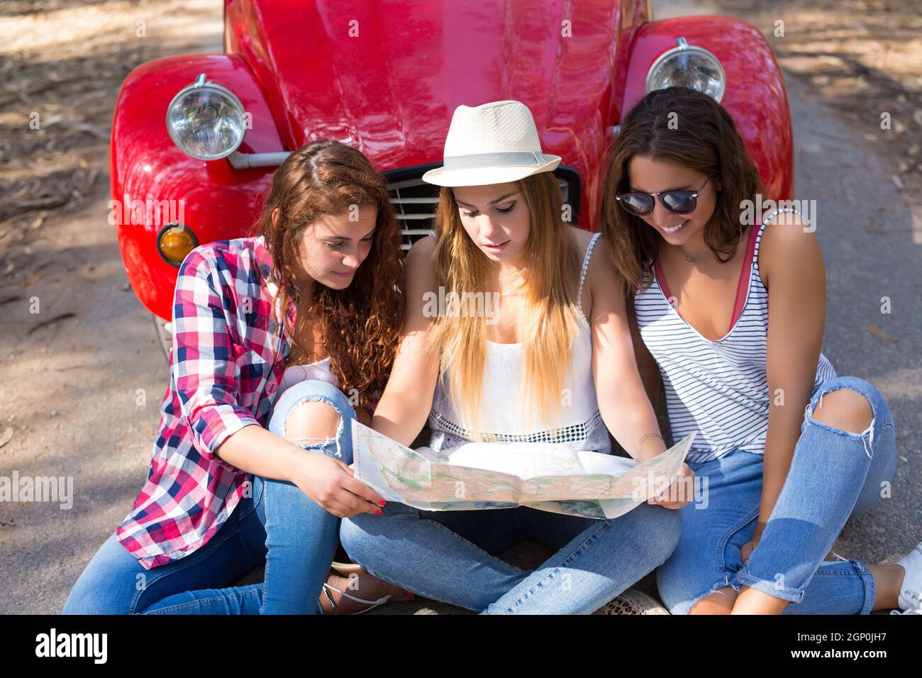 Group of friends on a roadtrip through countryside Stock Photo - Alamy