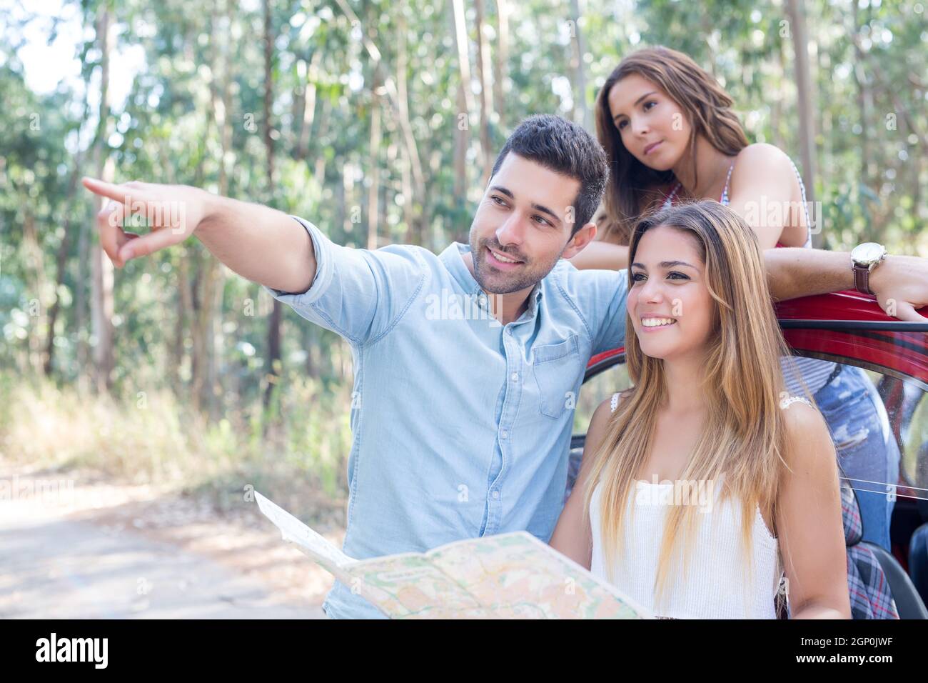 Group of friends on a roadtrip through countryside Stock Photo - Alamy