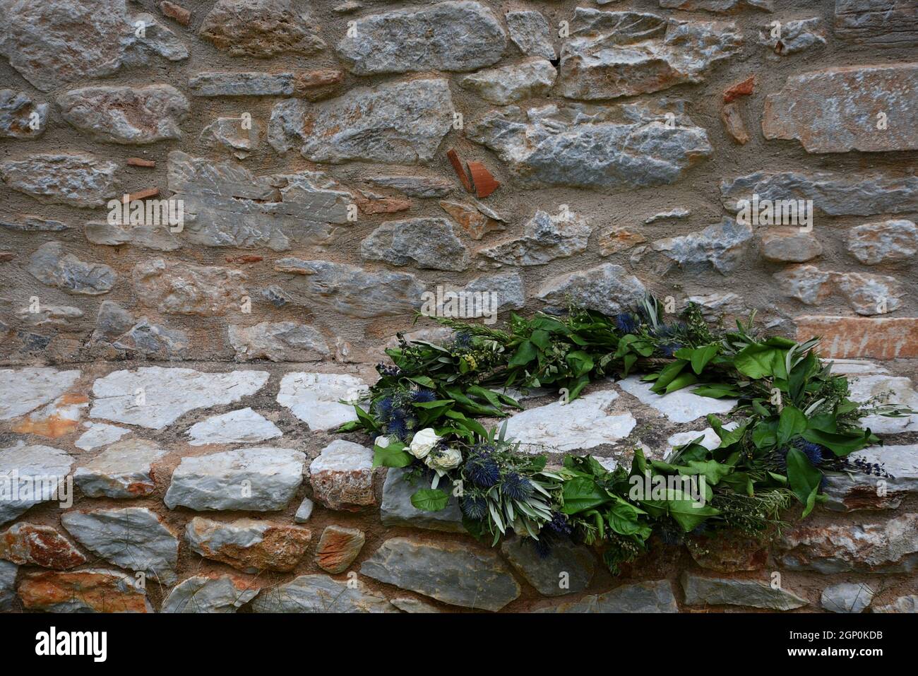 Handmade laurel wreath on the stone built mantel of Aghios Athanassios ...