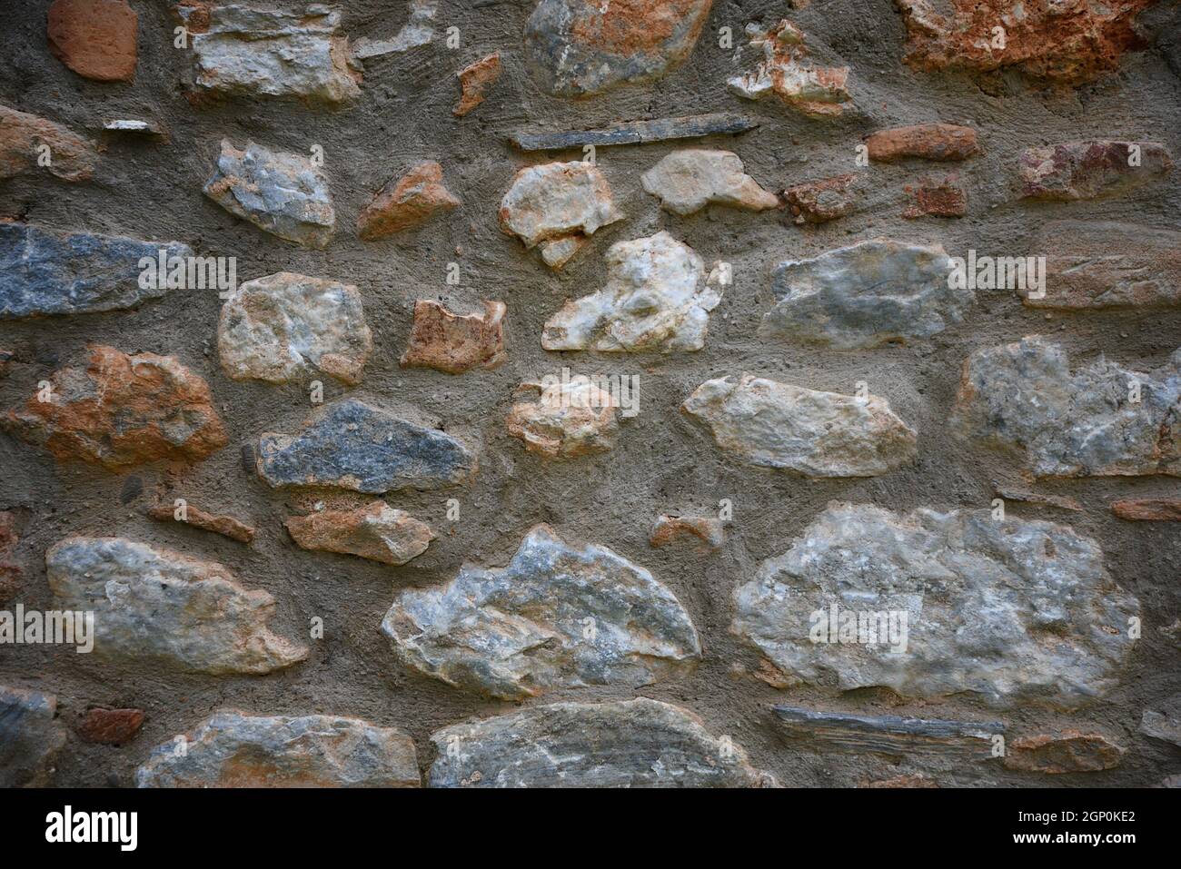 Exterior stone built wall of Aghios Athanassios a traditional Greek ...